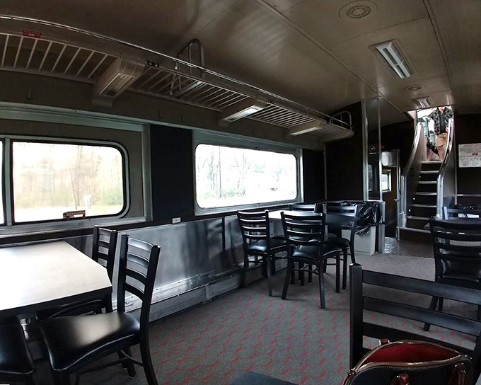 The dining car interior offers a glimpse of railway elegance, where passengers can enjoy a meal while watching Indiana's scenic countryside roll past the windows.
