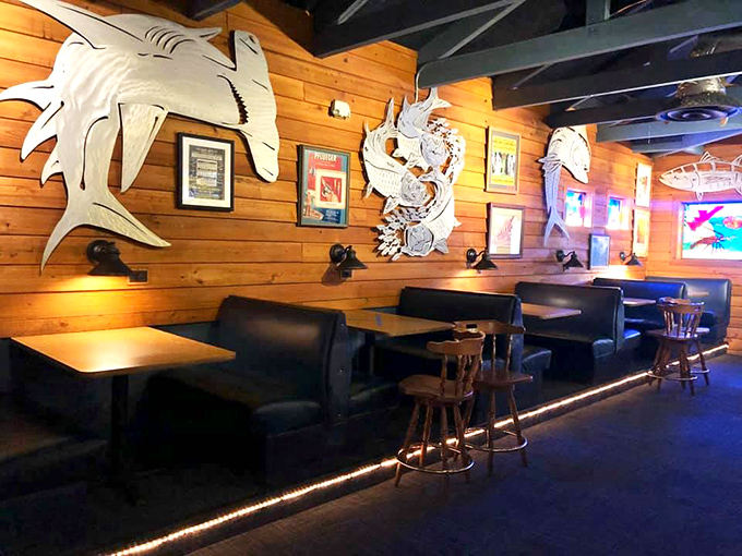 Nautical-themed wall art watches over comfortable booths where countless celebrations, first dates, and family gatherings have unfolded over delicious meals.