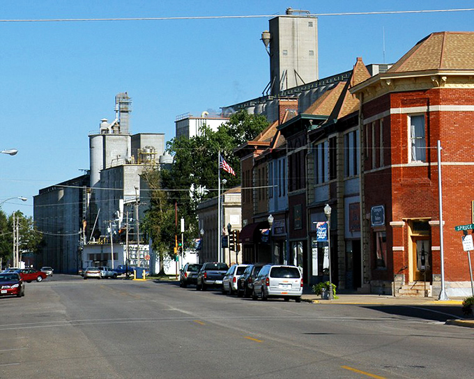 Grain elevators rise behind historic storefronts&mdash;a perfect metaphor for Abilene itself: firmly rooted in agricultural tradition while maintaining its charming downtown core.