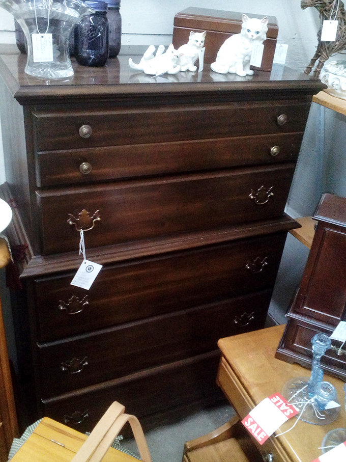 A tall dresser stands proud, its drawers likely holding decades of stories if wood could talk.