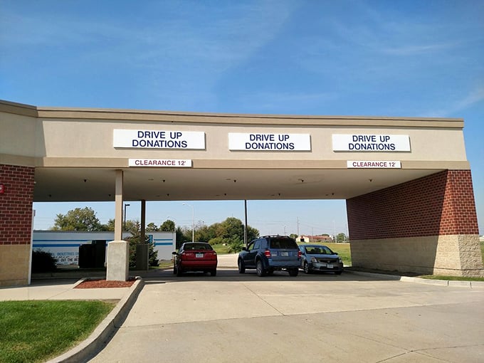 The drive-up donation area: where yesterday's belongings become tomorrow's discoveries. The circle of thrift life begins under these practical awnings.