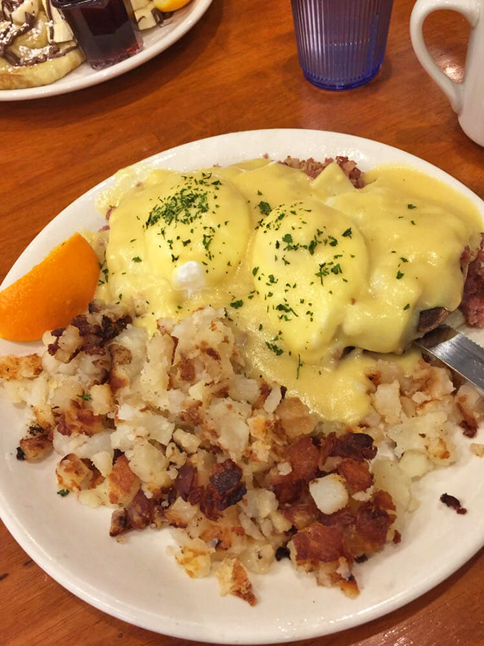 Eggs Benedict that's dressed for success with hollandaise that drapes like yellow silk over perfectly poached eggs and crispy potatoes.