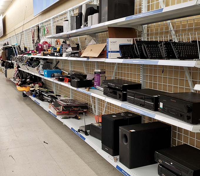 Electronics section where obsolete meets optimistic, and someone's trash becomes your nostalgic treasure.