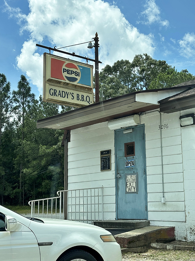 That weathered blue door has welcomed more happy bellies than a Black Friday sale at an elastic waistband factory.