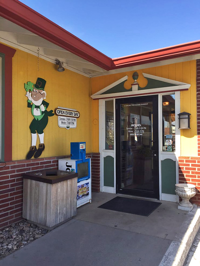 A leprechaun guards the entrance, suggesting lucky diners await inside. The yellow exterior hints at the sunny disposition of the staff within.