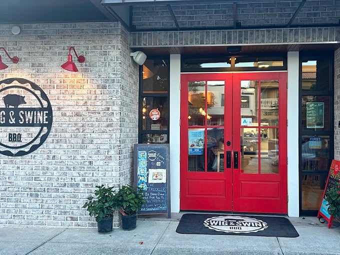 That red door might as well be a portal to meat paradise – the welcome mat practically screams "prepare your taste buds for liftoff."