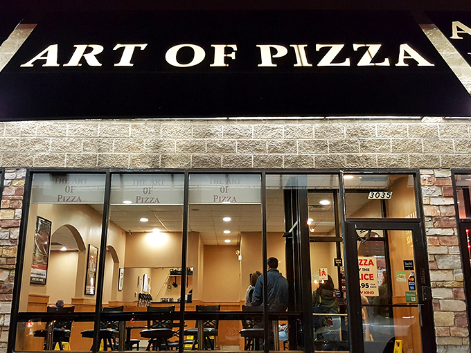 As night falls, The Art of Pizza's warm glow invites you in from the cold Chicago streets to experience deep dish nirvana.