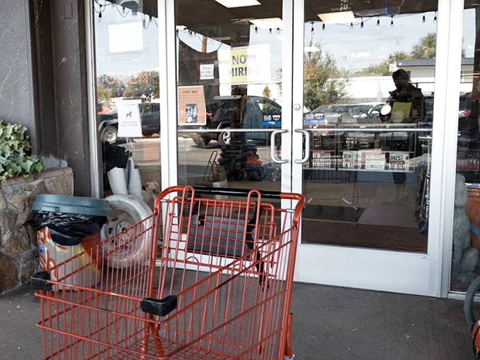 The entrance cart stands ready, like a chariot awaiting your thrifting adventure. Red, sturdy, and prepared for the weight of your discoveries.