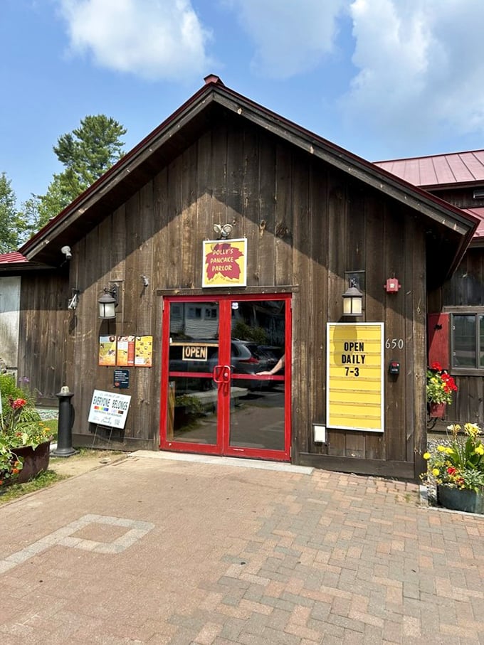 The entrance beckons like a portal to pancake paradise, with its rustic charm and promise of maple-scented memories.