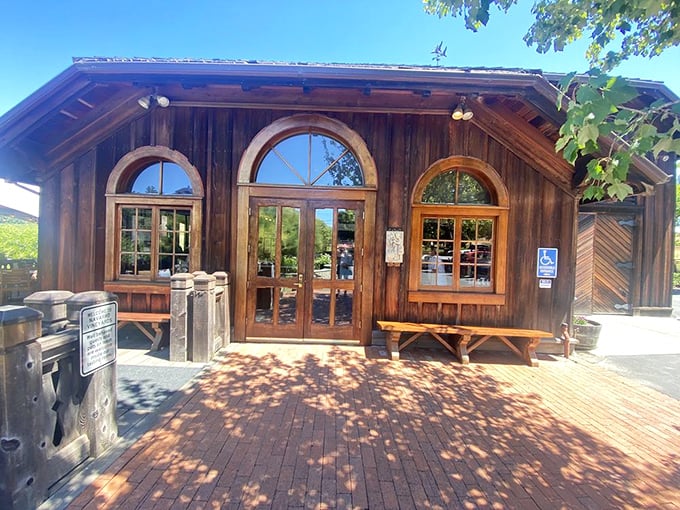 Rustic wooden architecture with arched windows welcomes visitors &ndash; like a storybook cottage that happens to serve exceptional wine.