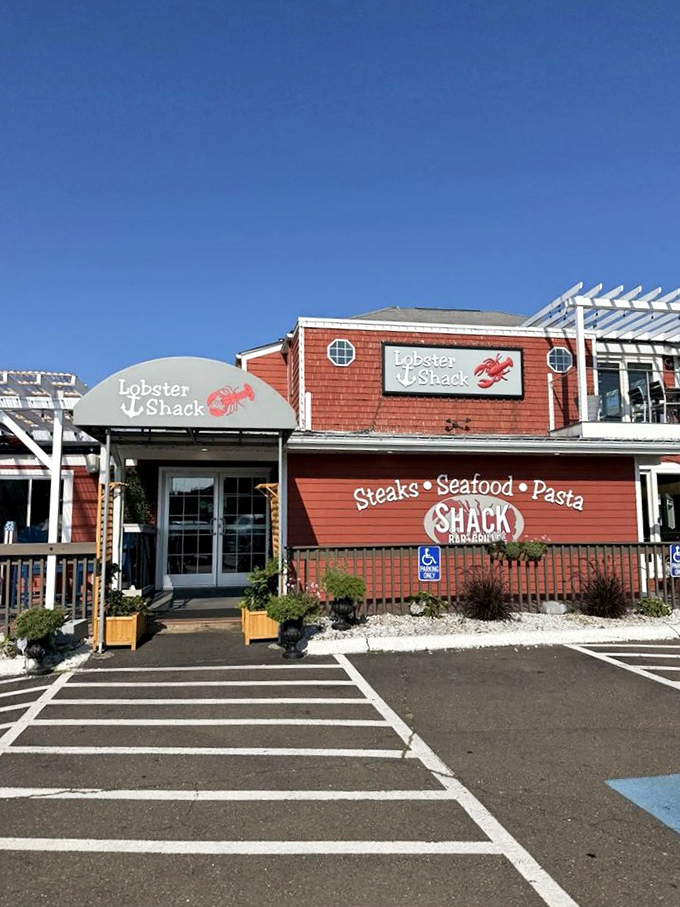 The entrance promises seafood salvation for weary travelers. That curved awning isn't just architectural flair—it's a gateway to butter-drenched happiness.