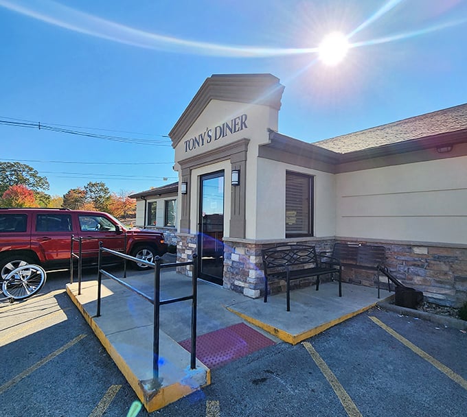 Morning sunlight creates a halo effect around Tony's entrance&mdash;nature's way of saying "Yes, this is the right choice for breakfast." The stone facade promises permanence in a world of pop-up restaurants.