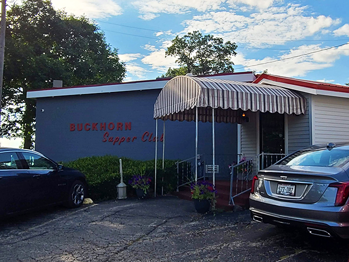 The blue exterior with striped awning stands like a beacon for hungry travelers. This isn't just a restaurant&mdash;it's a destination.
