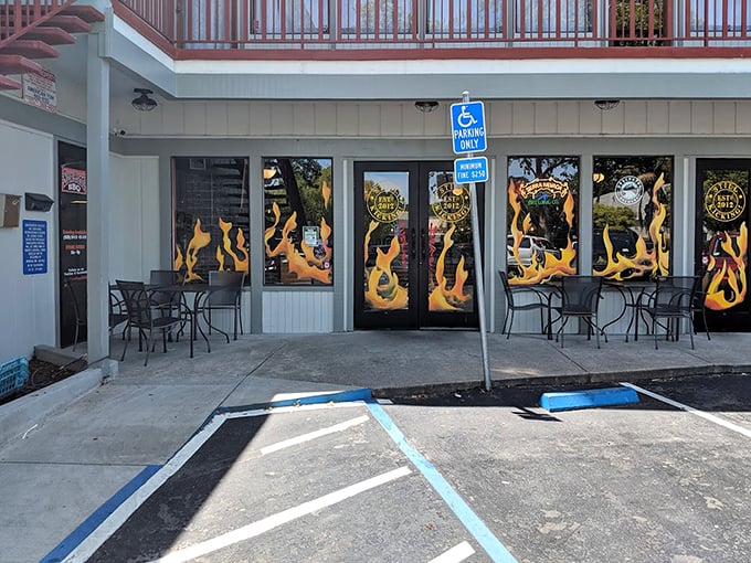 The flame-adorned entrance &ndash; a not-so-subtle hint at the smoky delights waiting inside this Pleasant Hill treasure.