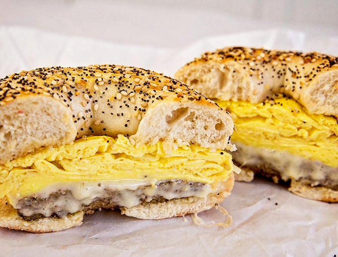 The everything bagel breakfast sandwich &ndash; where fluffy eggs and melted cheese find their perfect home between seeds and spices.