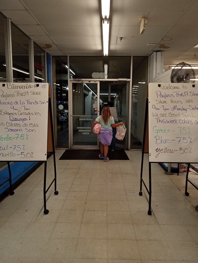 Whiteboard wisdom greets shoppers with this week's color-coded discounts. Green tags at 75% off? That's the thrifter's jackpot.