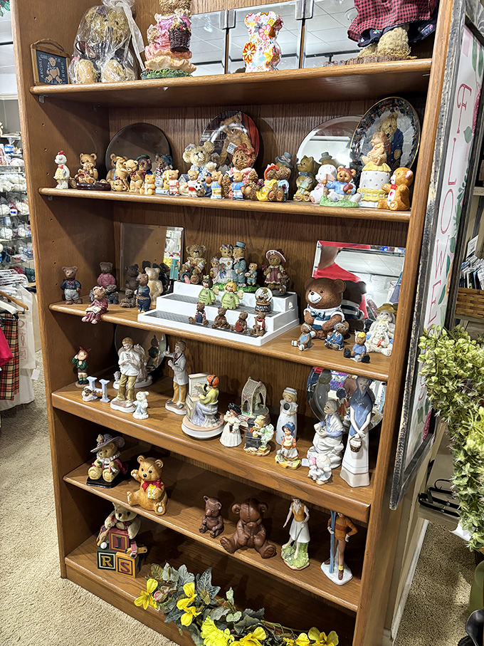 Collectible figurines stand in formation like a tiny ceramic army. One person's decluttered shelf becomes another's treasure trove.