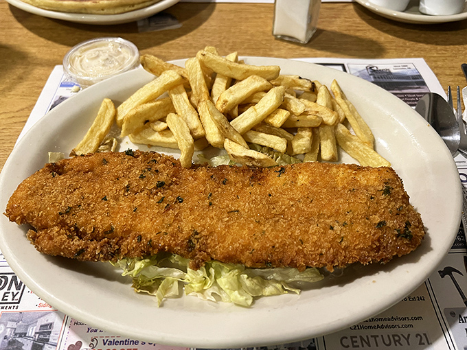 Fish and chips that would make a British pub jealous. That golden crust is protecting tender white fish like armor guards a treasure.