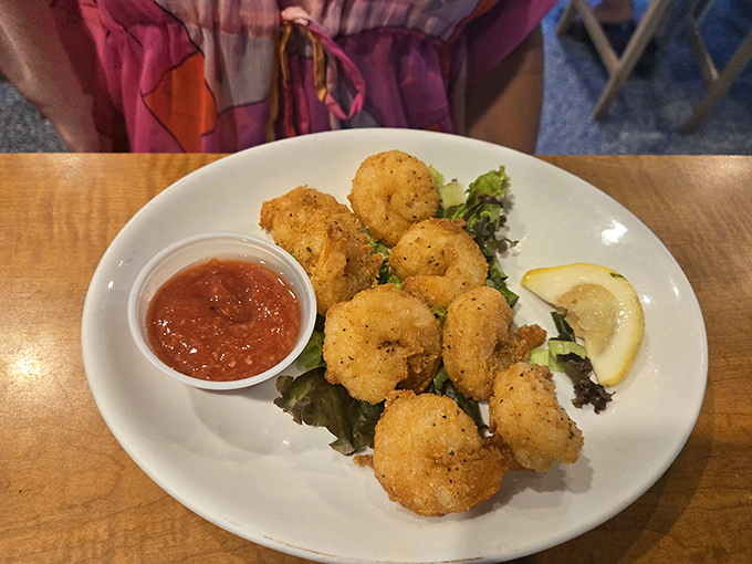 These golden-fried shrimp aren't just appetizers; they're little crispy ambassadors from the deep, bearing gifts of sweetness and brine.