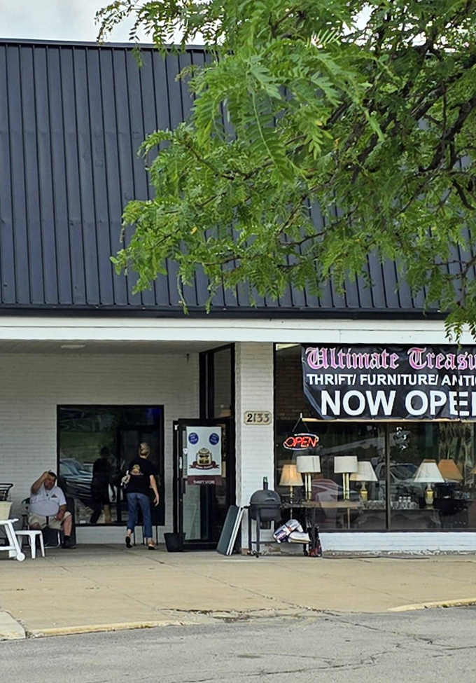 The welcoming entrance to bargain paradise. That "NOW OPEN" sign beckons to passersby with promises of undiscovered treasures within.