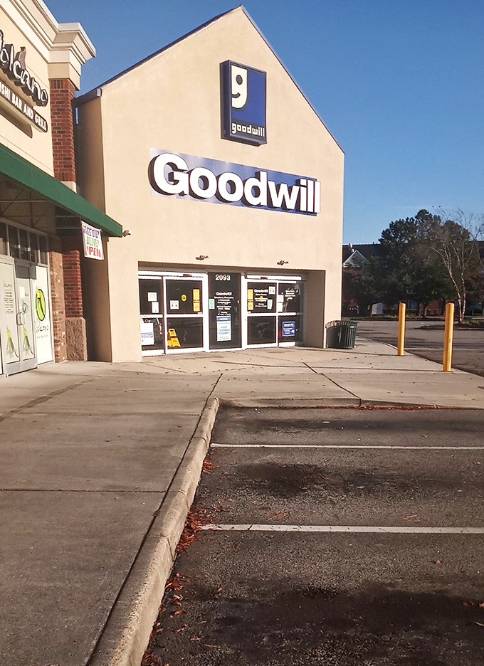 The distinctive Goodwill smile logo welcomes shoppers to 2093 General Booth Boulevard, where bargain hunting becomes an adventure sport.