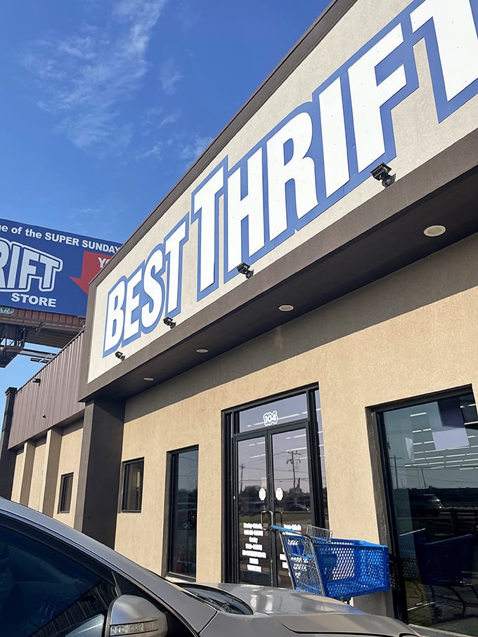 The bold blue lettering stands out against the Oklahoma sky &ndash; not just a sign, but a promise of affordable discoveries waiting inside.
