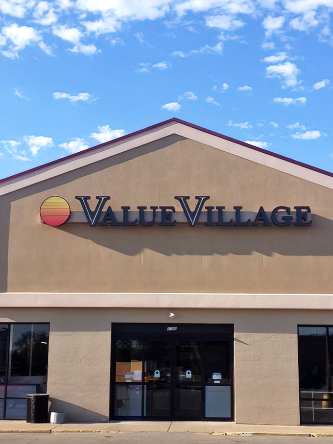 The sunset-inspired logo of Value Village glows against the clear Wisconsin sky, welcoming thrifters from near and far.