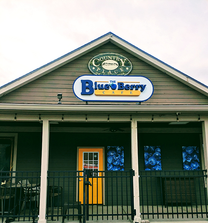 The cheerful yellow door and blueberry-adorned windows offer a warm welcome that says, "Inside these walls, breakfast is taken very, very seriously."