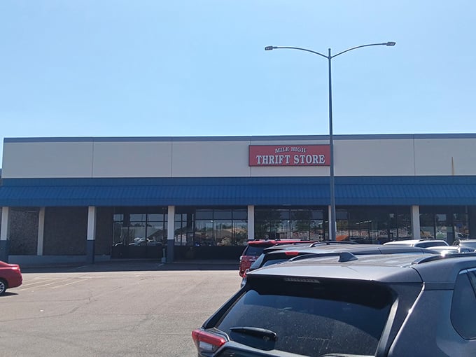 The Mile High Thrift Store sign beckons from the strip mall exterior&mdash;an unassuming facade concealing a warehouse of possibilities within.