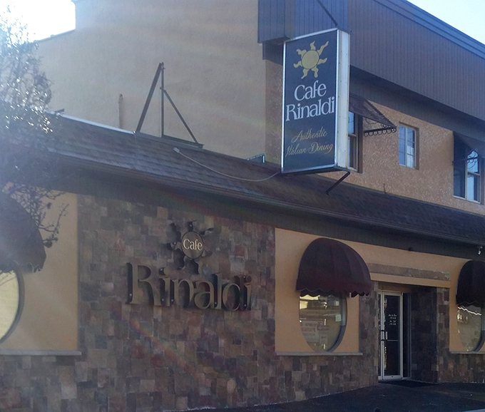 In daylight, Caf&eacute; Rinaldi's charming fa&ccedil;ade offers a preview of the warmth waiting inside. Those stone accents aren't just decorative&mdash;they're foundational.