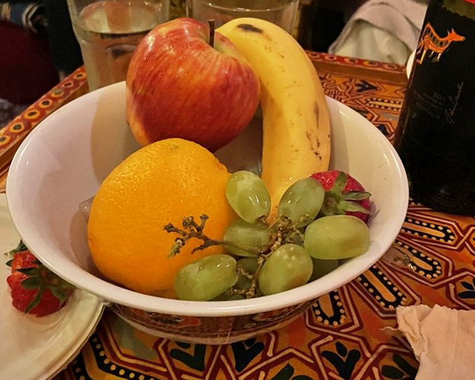 The meal's finale arrives with simple, fresh fruit&mdash;nature's palate cleanser after a flavor journey that's taken your taste buds across the Mediterranean and back.