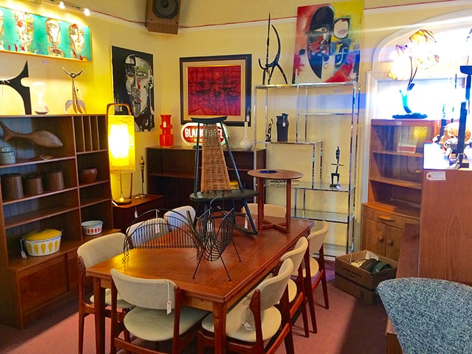 Mid-century modern furniture arranged like a museum exhibit. Don Draper would approve of this dining set's clean lines and warm wood.