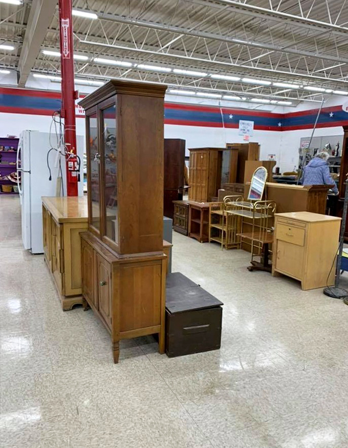 Furniture that tells a story lines the aisles. These wooden sentinels have weathered family dinners, homework sessions, and countless conversations.