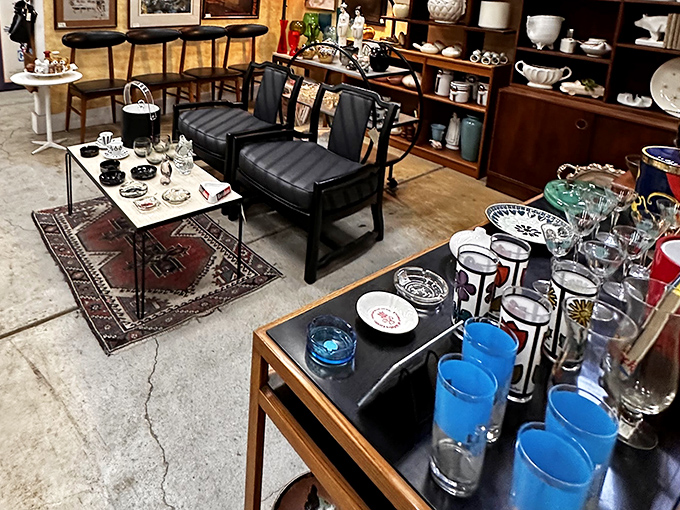 Mid-century modern furniture and glassware arranged like a movie set waiting for martini-sipping characters to enter stage right.
