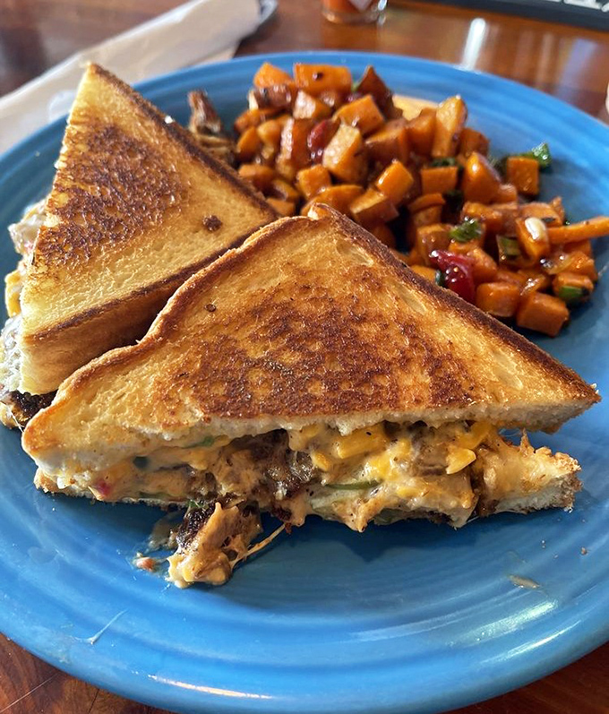 This isn't just a grilled cheese&mdash;it's a masterclass in the art of sandwich architecture, with golden-brown bread barely containing its gooey, melty interior.