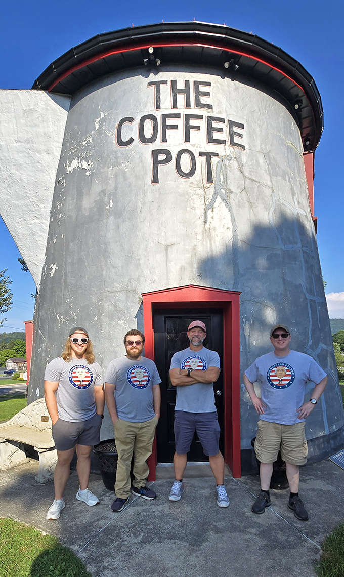 Coffee lovers unite! Visitors pose proudly before this monument to America's favorite morning beverage, creating memories as lasting as the landmark itself.