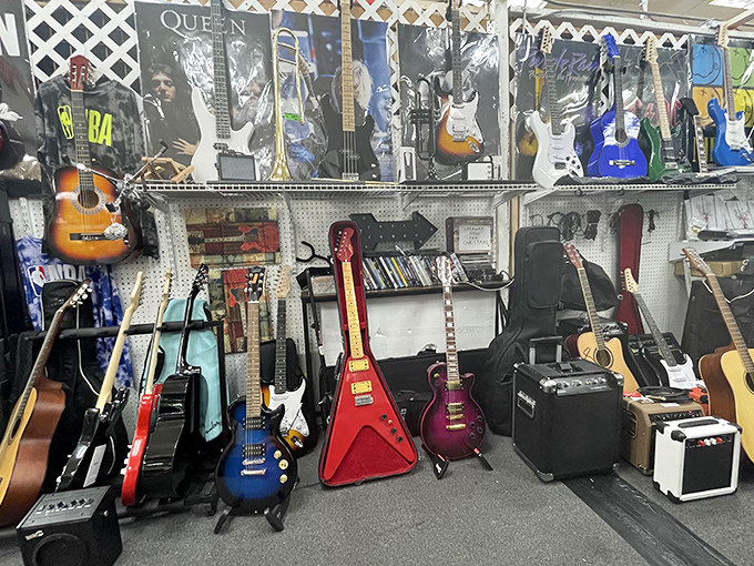The guitar corner: where musical dreams hang in suspended animation, each instrument silently promising to turn its next owner into the next Hendrix or Clapton.