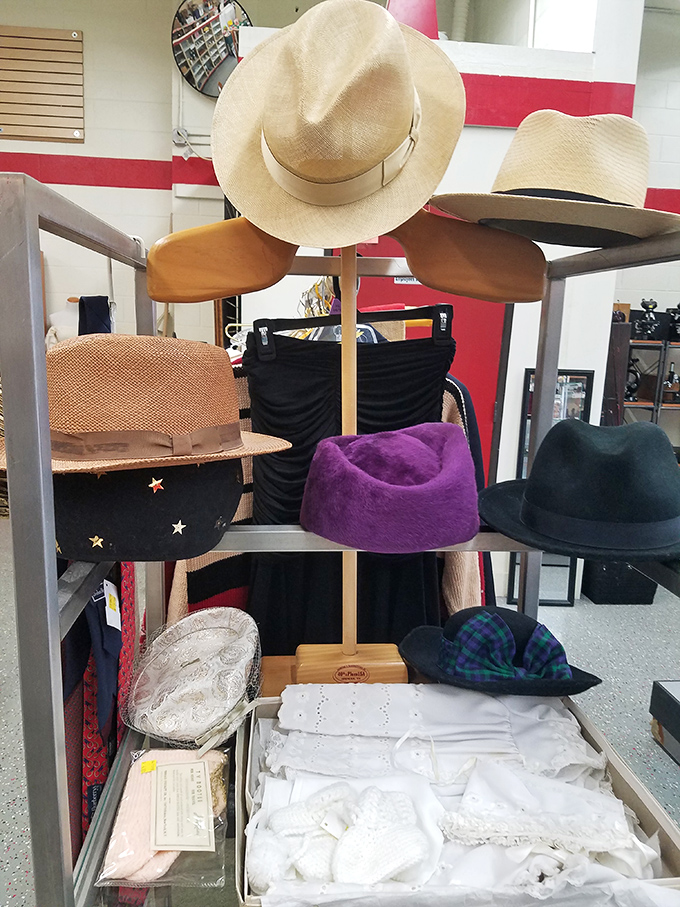 The hat stand: where fedoras, sun hats, and berets wait for their perfect match&mdash;because nothing completes a thrift store triumph like the perfect topper.