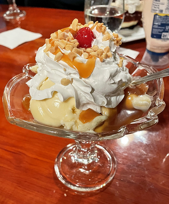 This isn't just dessert&mdash;it's architecture with whipped cream, a caramel waterfall cascading over vanilla ice cream with the cherry on top serving as the perfect exclamation point.