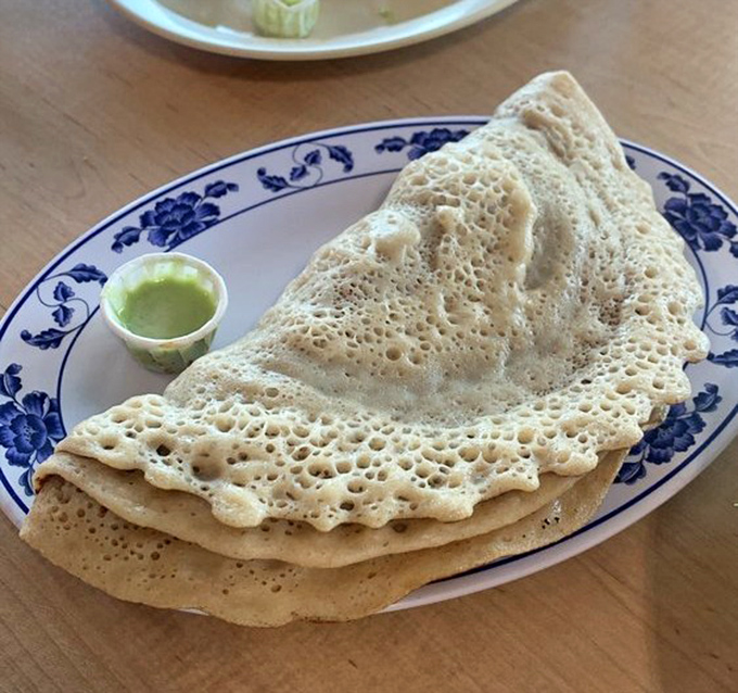 Injera&mdash;the spongy sourdough flatbread that's both your utensil and part of your meal. Eating with your hands never felt so sophisticated.