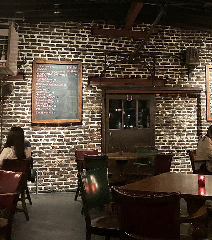 Exposed brick walls and chalkboard menus create an atmosphere where comfort meets sophistication, and every table feels like the best seat in the house.