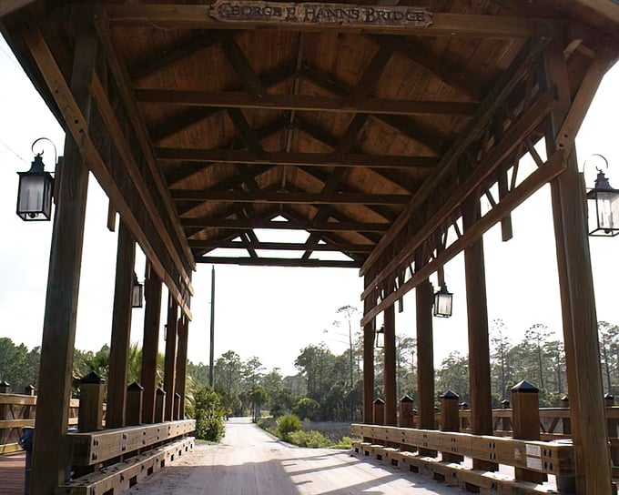 Lanterns hanging from rough-hewn beams create an almost magical passage. Look up and you'll spot the bridge's namesake dedication.