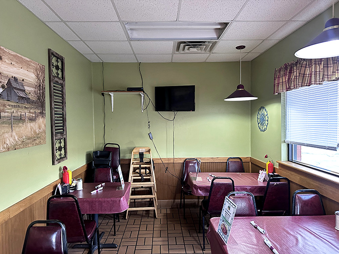 The dining room's mint green walls and rural artwork create that perfect "grandma's house" vibe where calories somehow don't count.