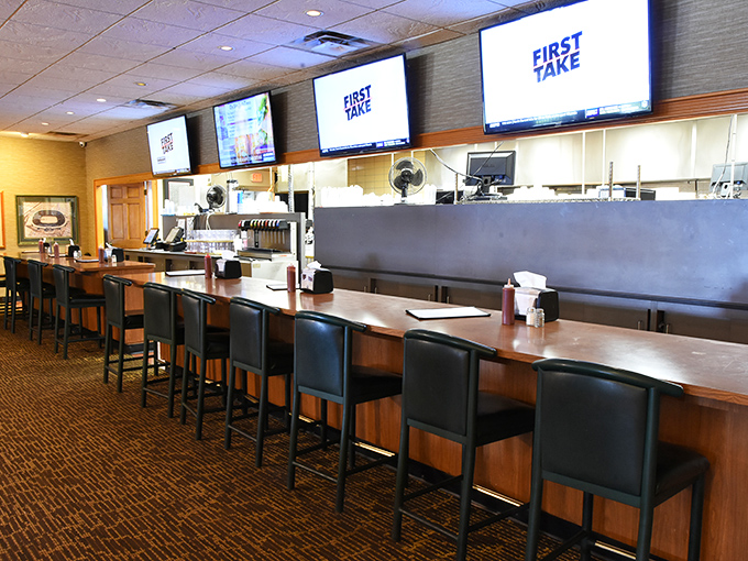 The bar area beckons with promises of cold drinks and game-watching camaraderie - community dining at heart.
