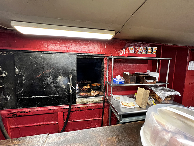 The business end of the operation where smoke and time transform ordinary pork into extraordinary sandwiches.