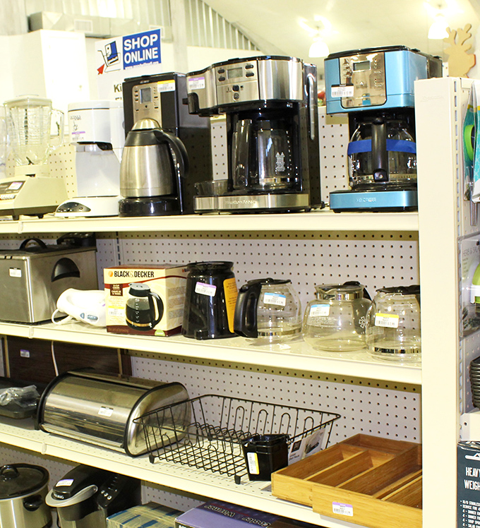 Coffee makers and kitchen essentials line these pegboard shelves&mdash;because nothing says "adulting success" like scoring a working Keurig for pocket change.
