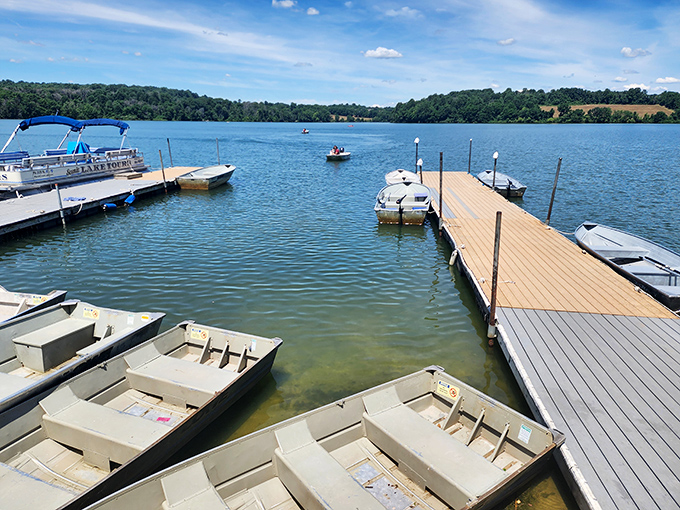 Wooden docks extend like welcoming arms into the lake. Each boat patiently waits for its chance to dance across the water.