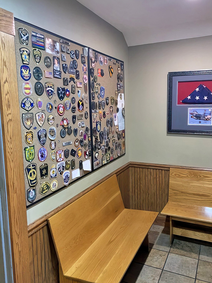 A wall of patches tells stories of service and community, reminding diners that this restaurant is more than just a place to eat &ndash; it's a gathering spot for heroes.