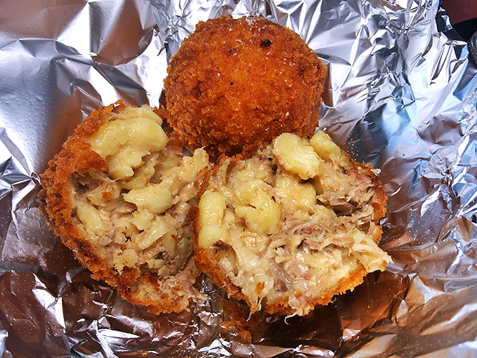 Mac and cheese transformed into golden-fried spheres of joy—because sometimes the best comfort food is the kind you can pop in one bite.