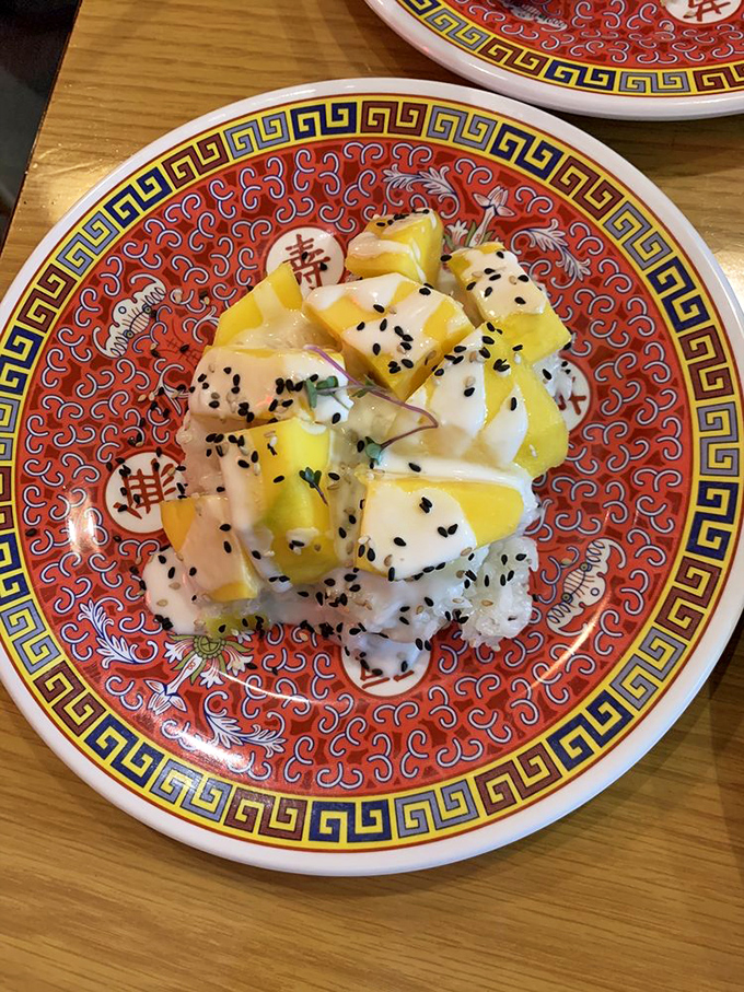 Mango sweet rice sprinkled with black sesame seeds&mdash;the dessert that proves fruit and rice can be friends with benefits.